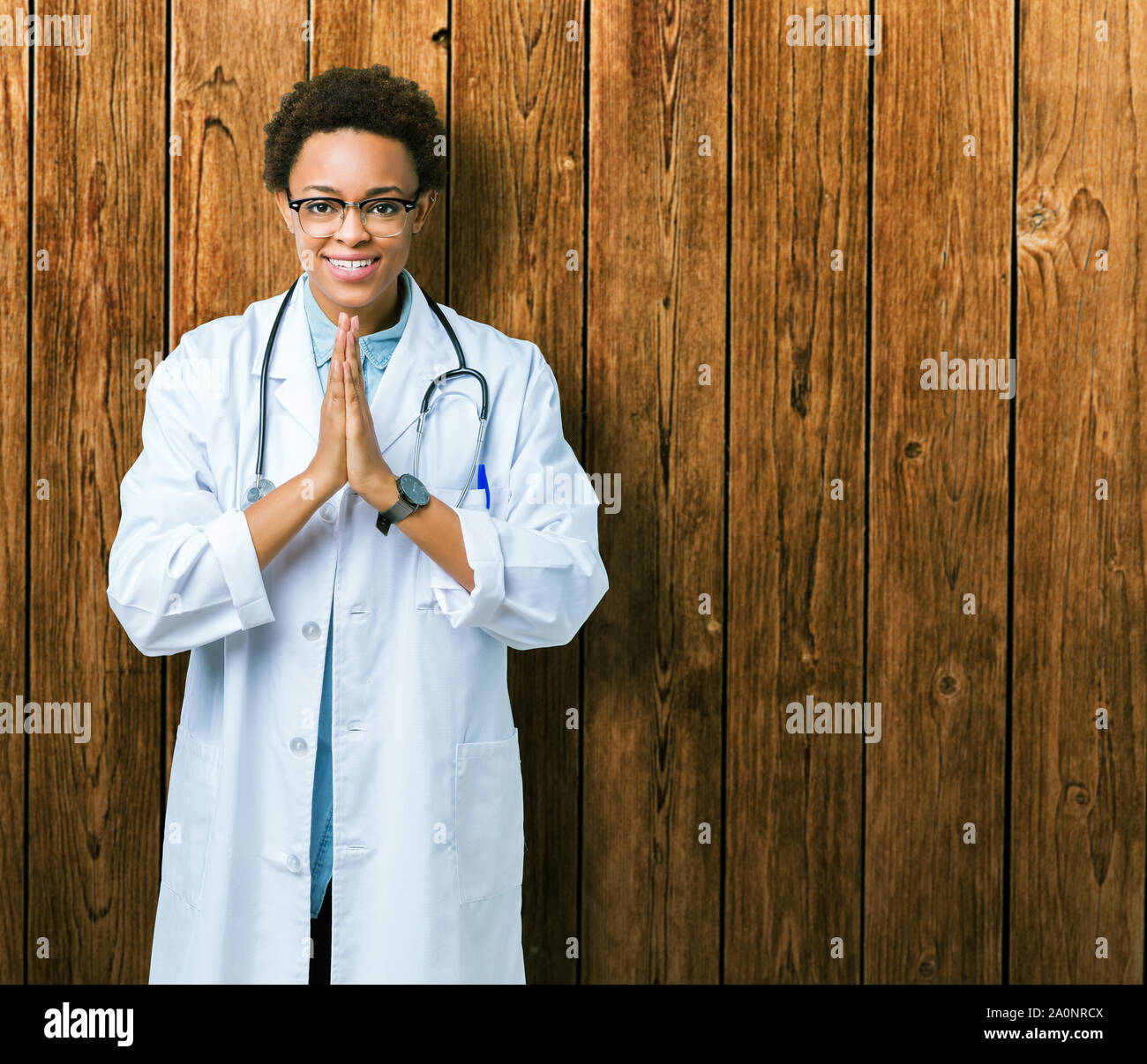 Young african american doctor woman wearing medical coat over isolated ...