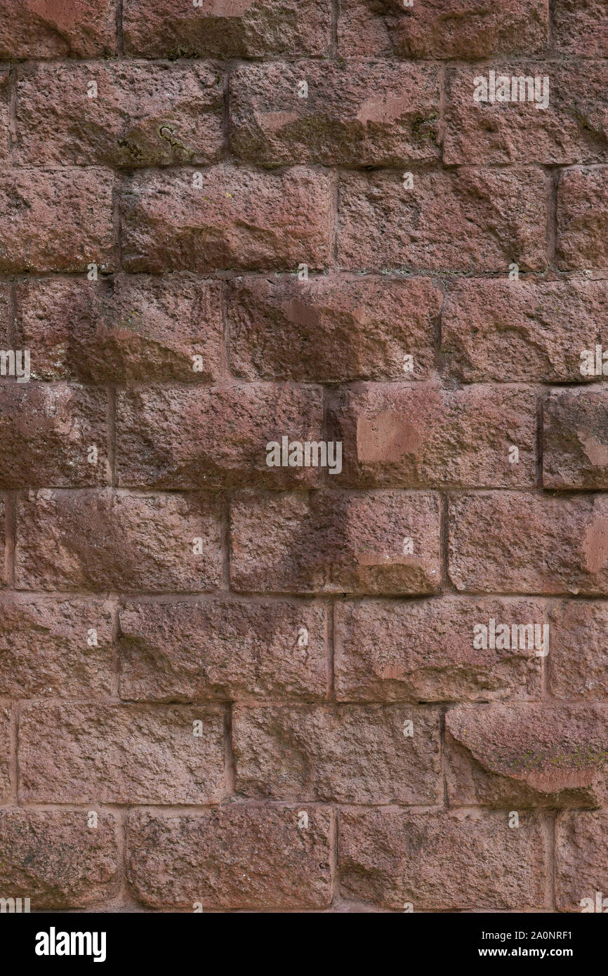 Rough decorative tile of maroon color on the wall Stock Photo - Alamy