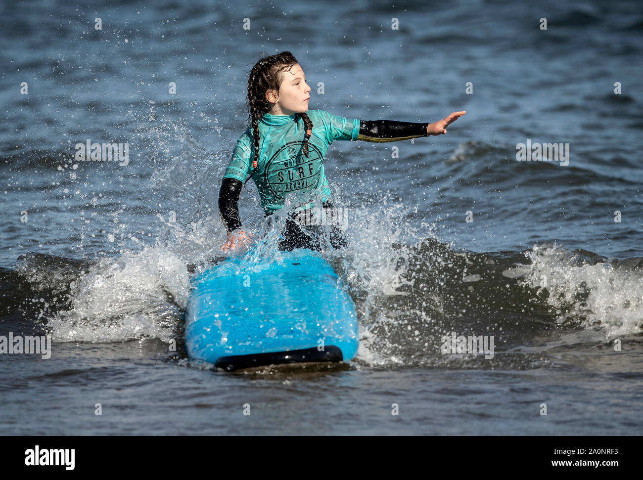 Holly owen during surfing lesson on whitby beach in yorkshire hi-res ...