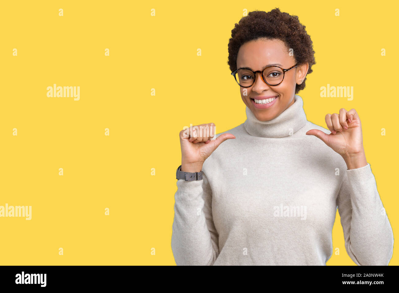 Young beautiful african american woman wearing glasses over isolated background looking ...