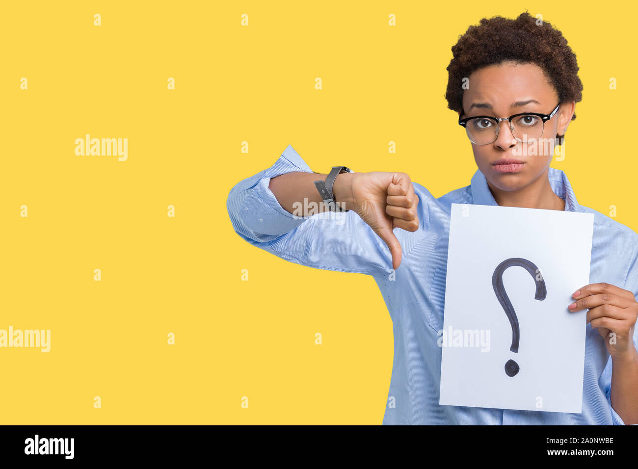 Young african american woman holding paper with question mark over ...