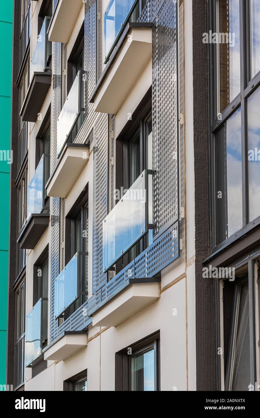 Angular view of modern block of flats with glass balconies Stock Photo ...
