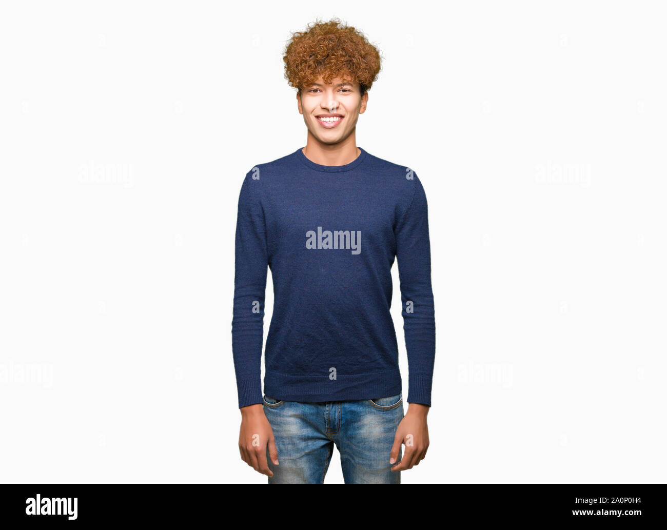 Young handsome man with afro hair with a happy and cool smile on face ...