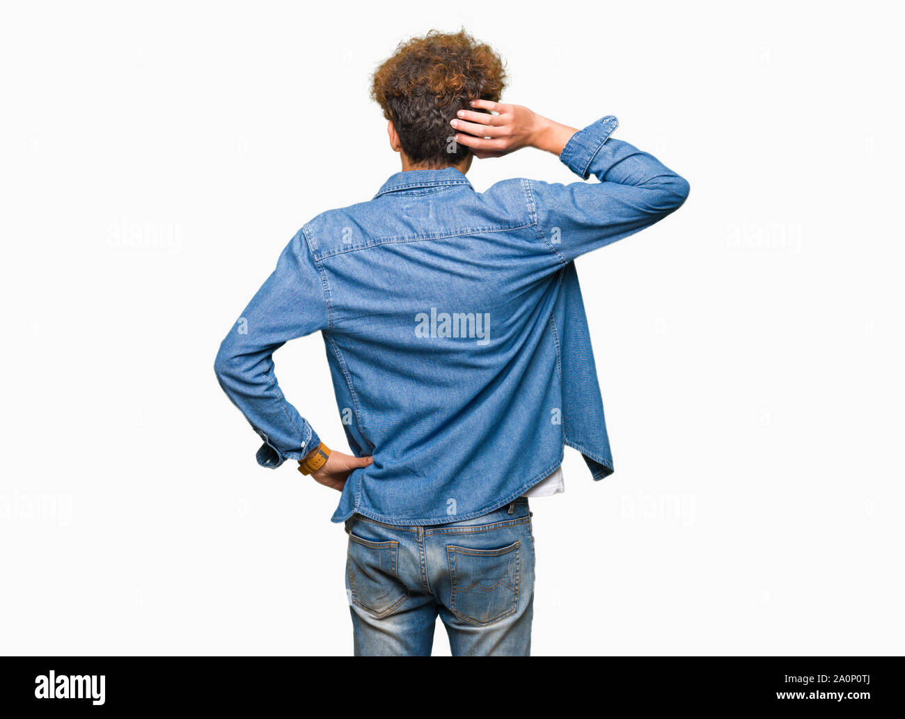 Young handsome man with afro hair wearing denim jacket Backwards ...