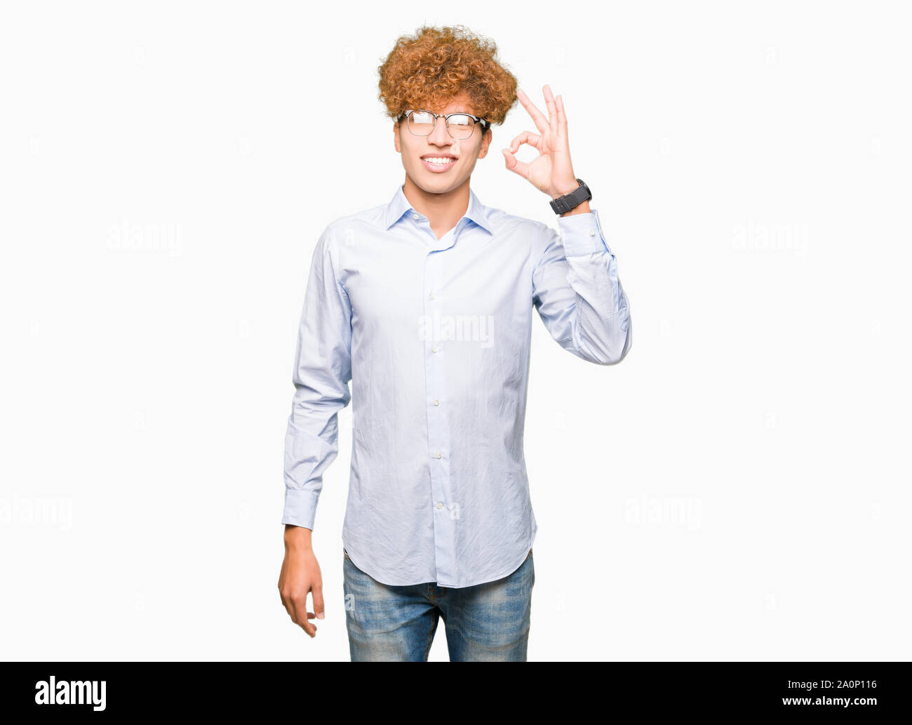 Young handsome business man with afro wearing glasses smiling positive ...