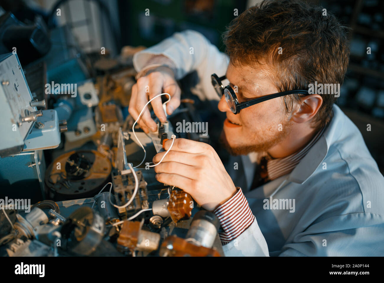 Scientist prototyping electrical device in lab Stock Photo - Alamy