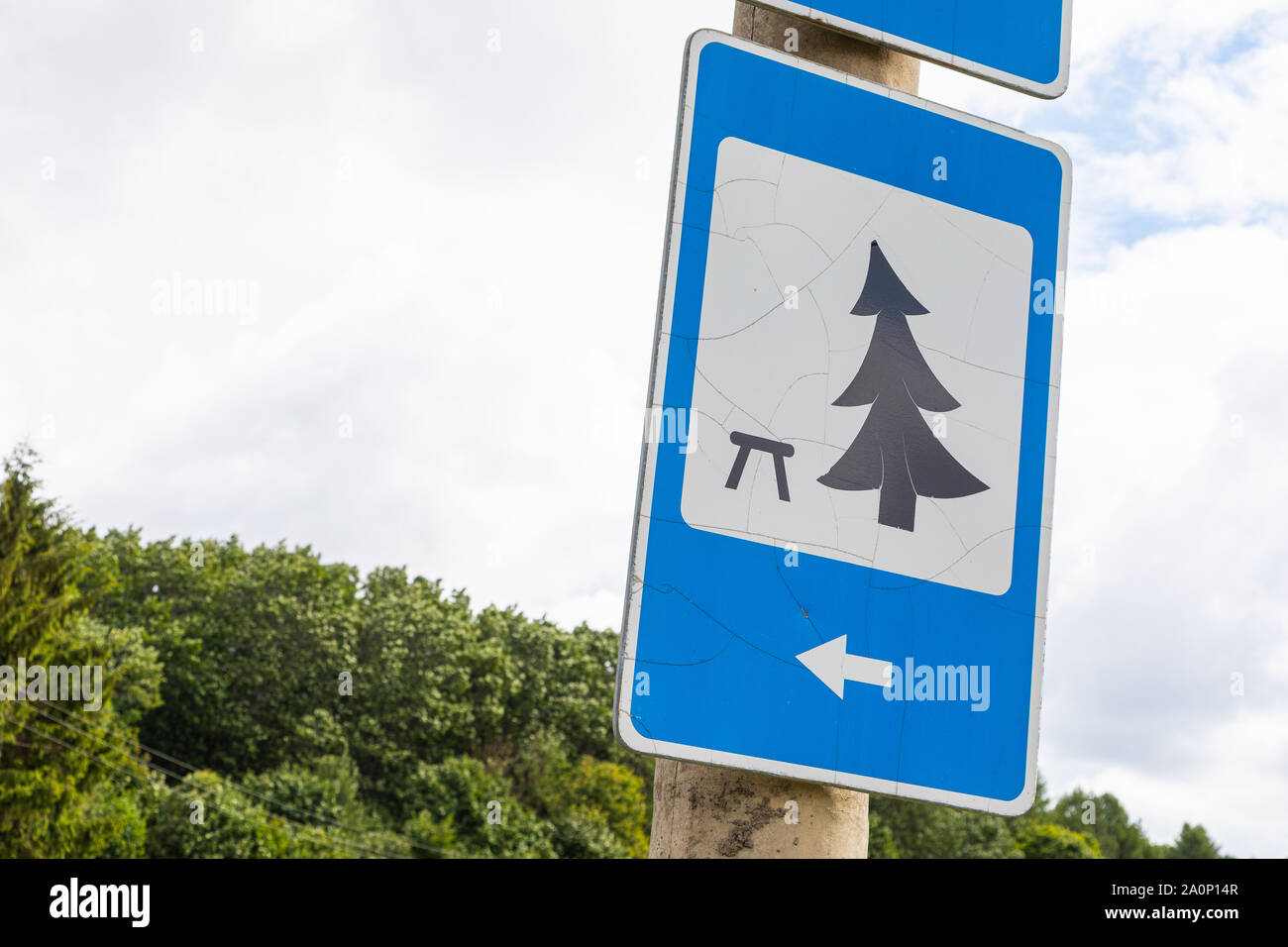 Road sign Service area with arrow pointing direction against sky and ...