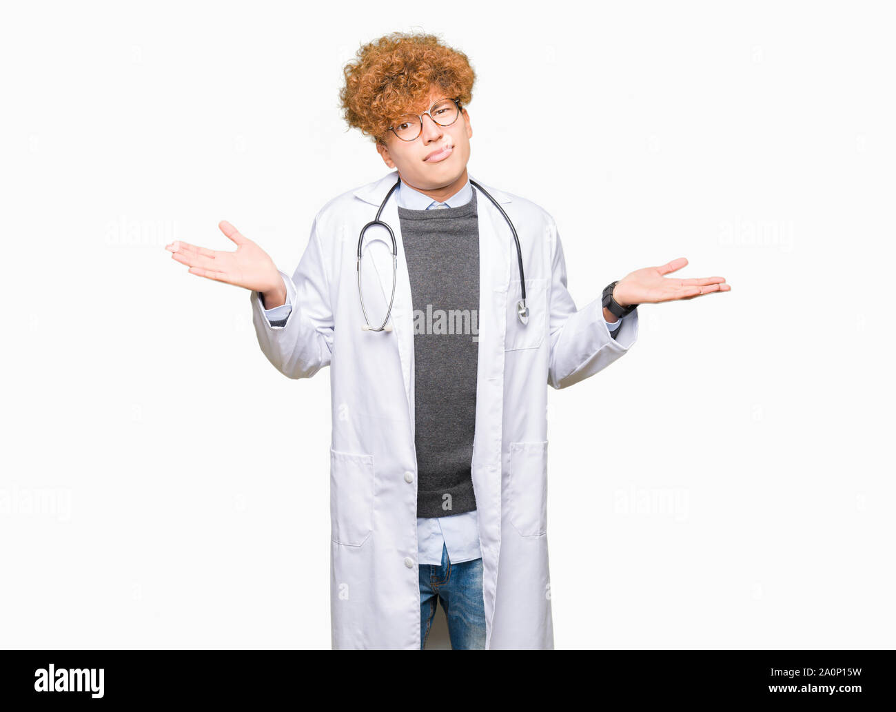 Young handsome doctor man wearing medical coat clueless and confused ...
