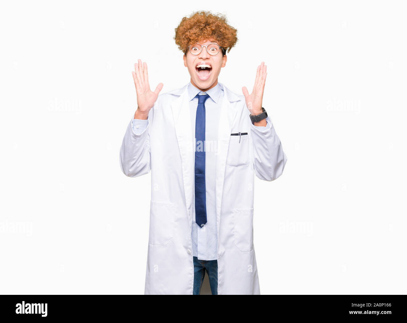 Young handsome scientist man wearing glasses celebrating crazy and ...