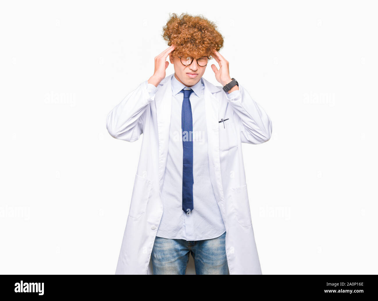 Young handsome scientist man wearing glasses with hand on head for pain ...