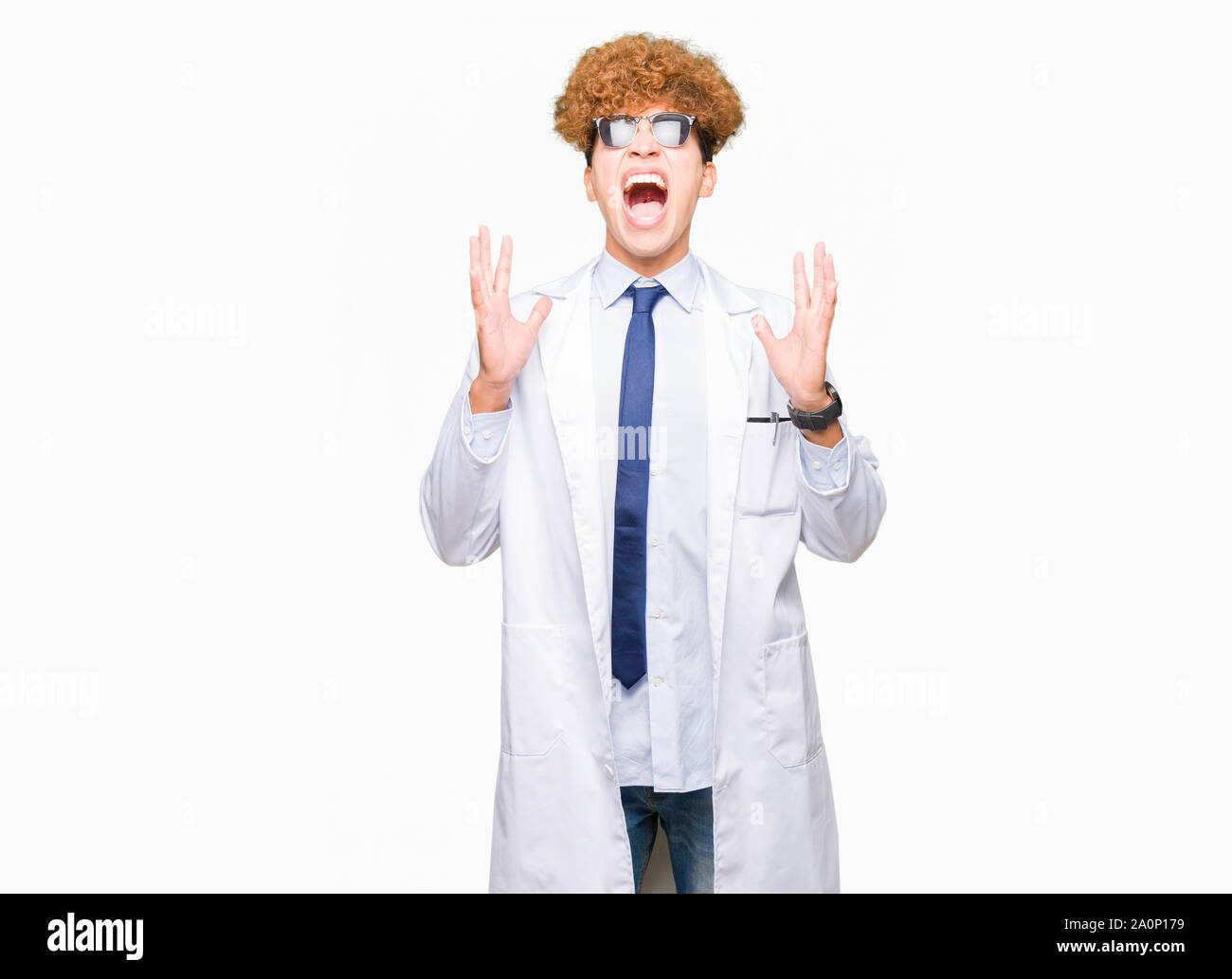 Young handsome scientist man wearing professional coat and sunglasses ...