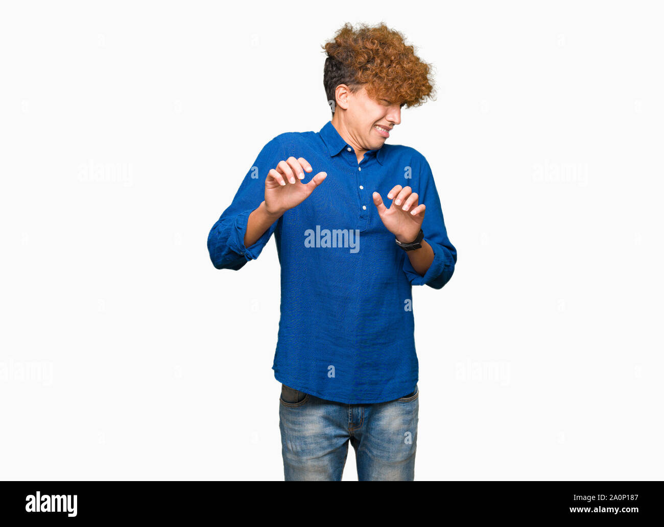 Young handsome elegant man with afro hair disgusted expression ...