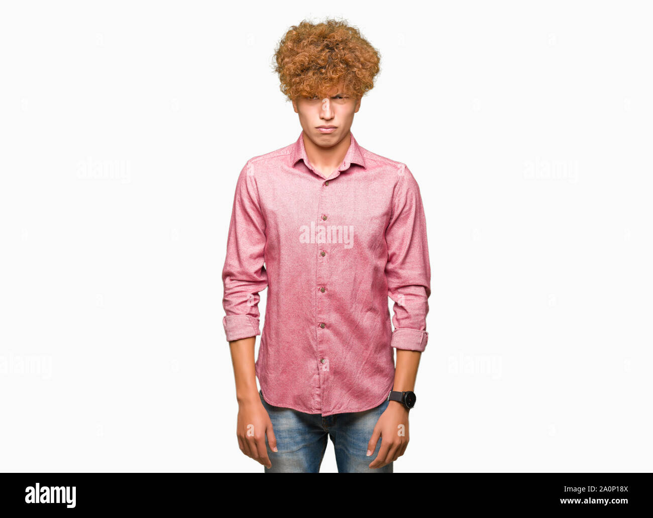 Young handsome business man with afro hair skeptic and nervous ...