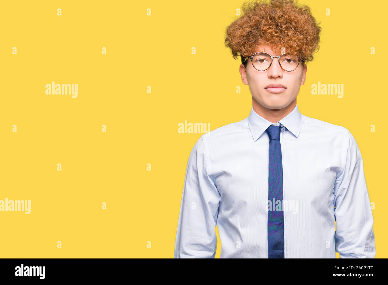 Young handsome business man with afro wearing glasses Relaxed with ...