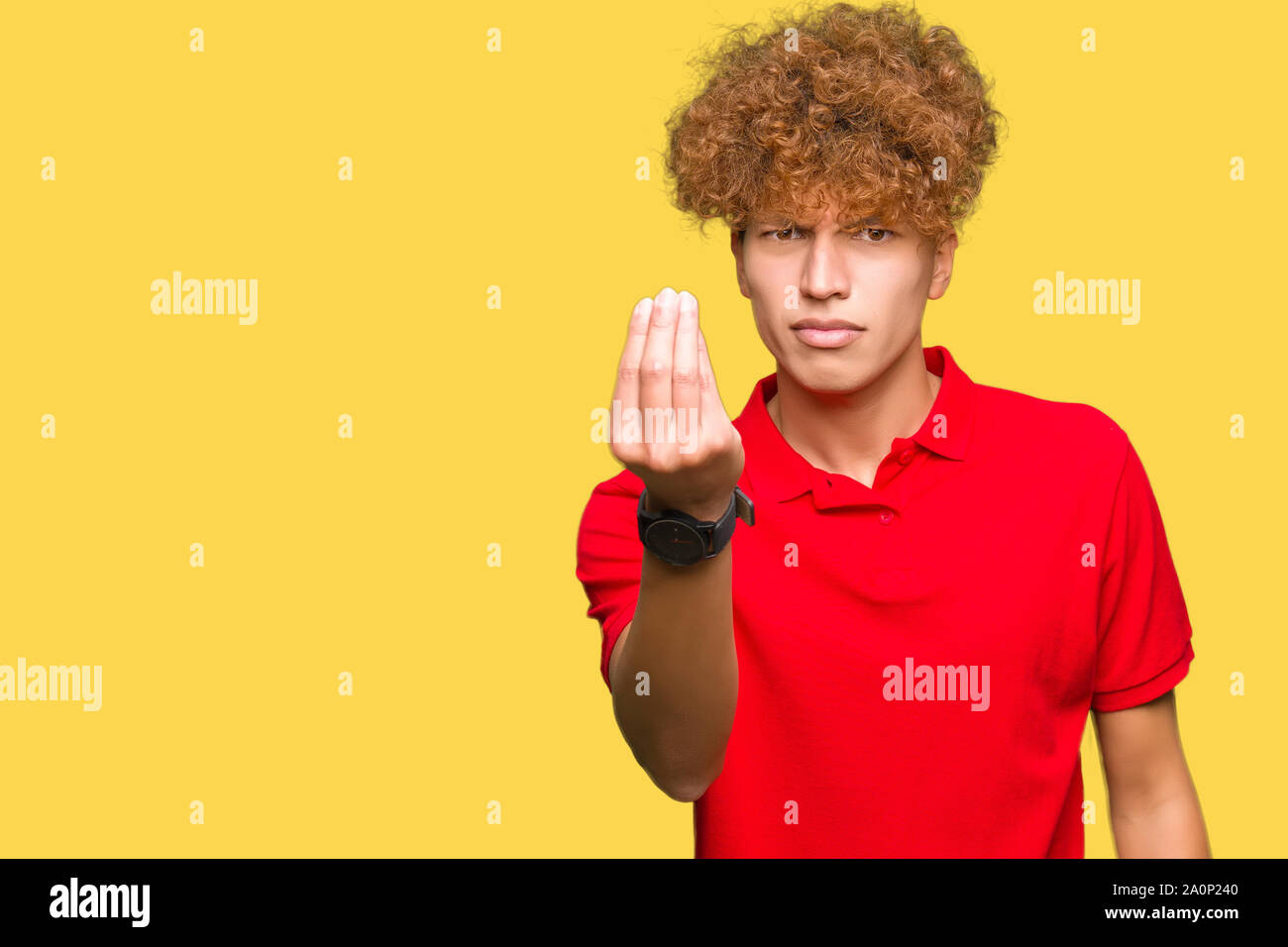 Young handsome man with afro hair wearing red t-shirt Doing Italian ...