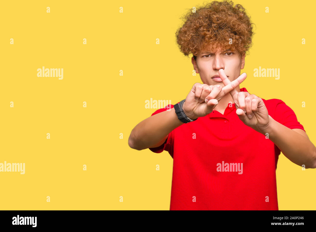 Young handsome man with afro hair wearing red t-shirt Rejection ...