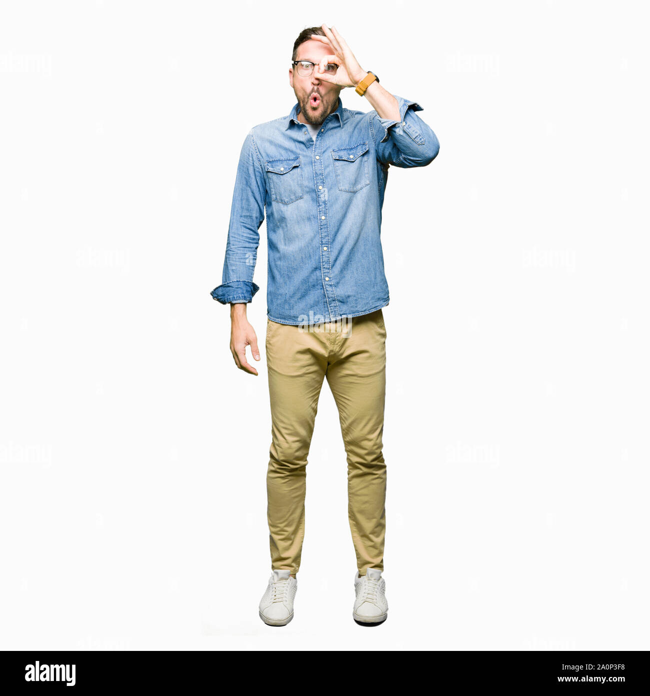 Handsome man wearing glasses doing ok gesture shocked with surprised ...