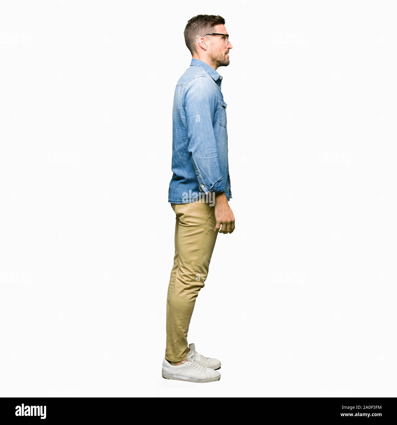 Handsome man wearing glasses looking to side, relax profile pose with ...