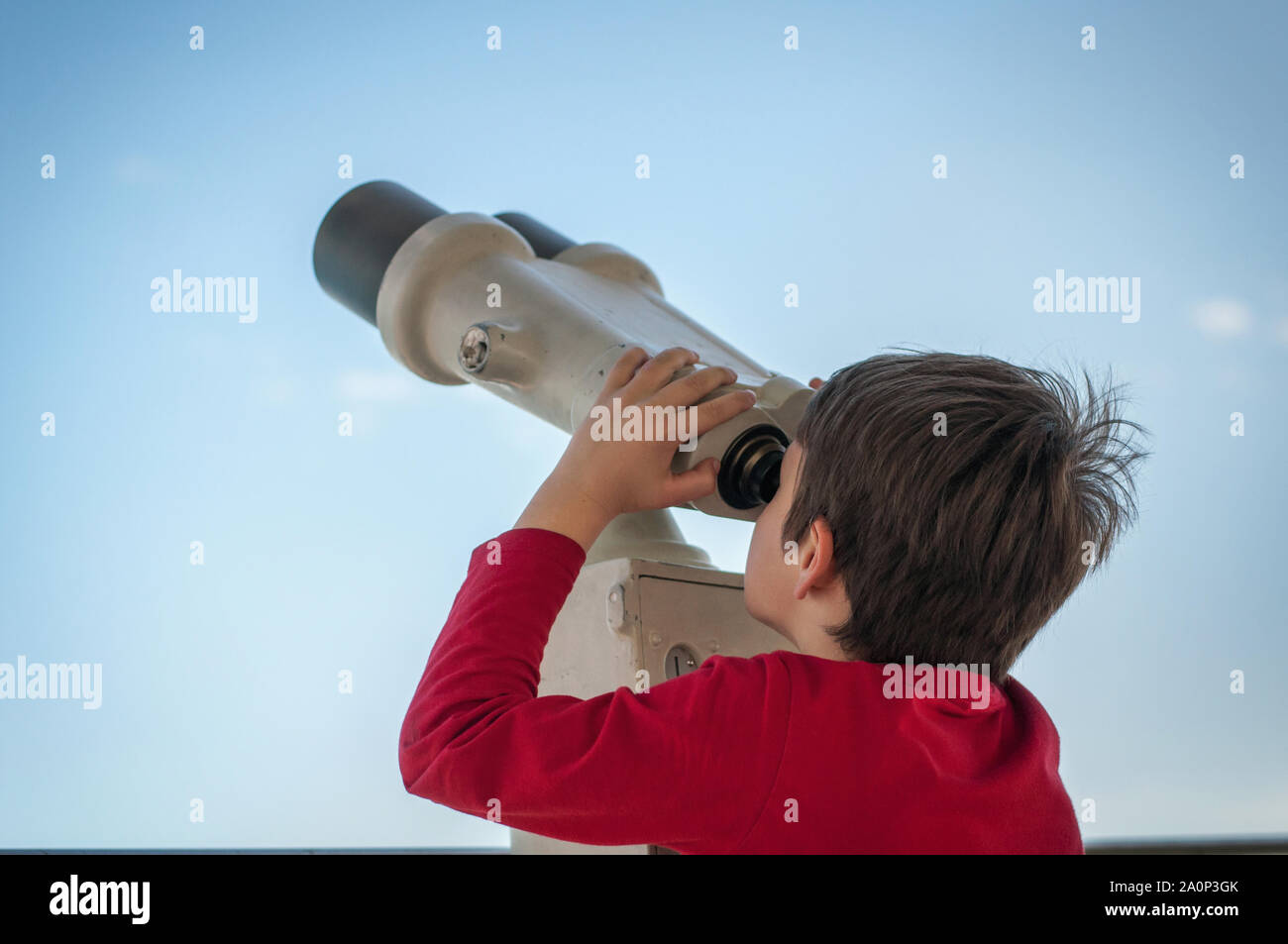 Child looking through a telescope hi-res stock photography and images ...