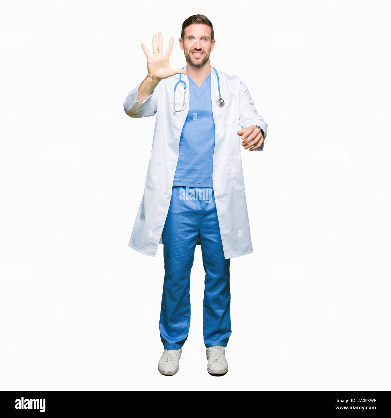 Handsome doctor man wearing medical uniform over isolated background ...