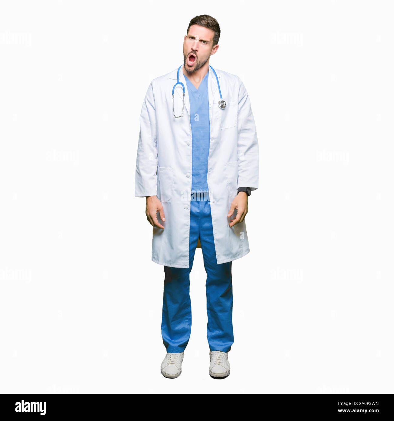 Handsome doctor man wearing medical uniform over isolated background In ...