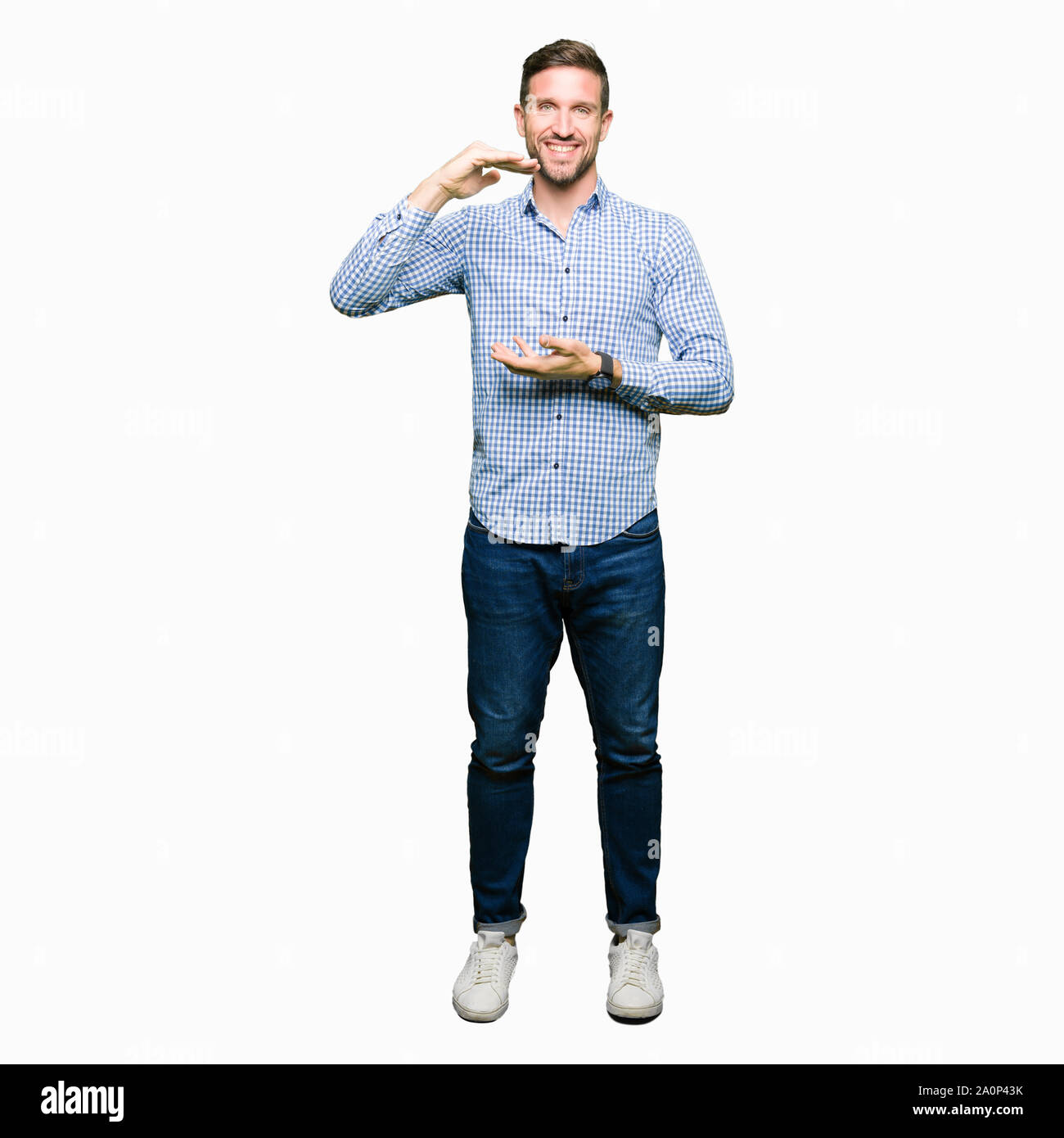 Handsome business man with blue eyes gesturing with hands showing big ...