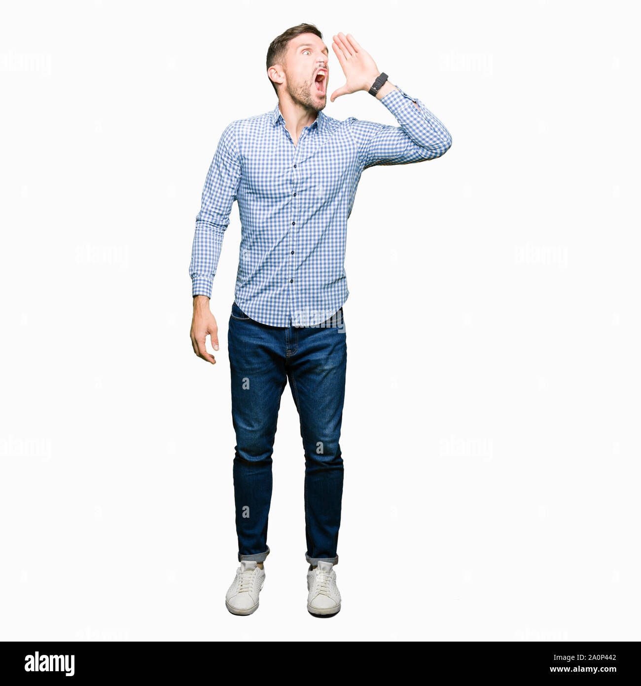 Handsome business man with blue eyes shouting and screaming loud to ...