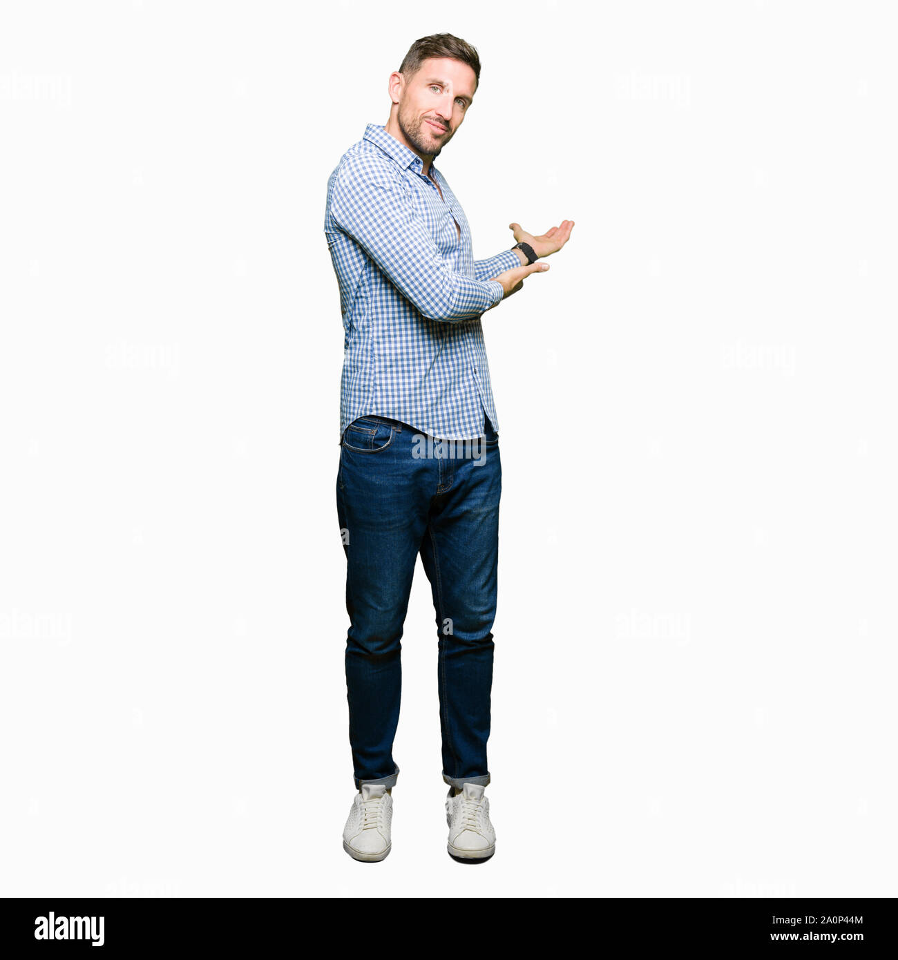 Handsome business man with blue eyes Inviting to enter smiling natural ...