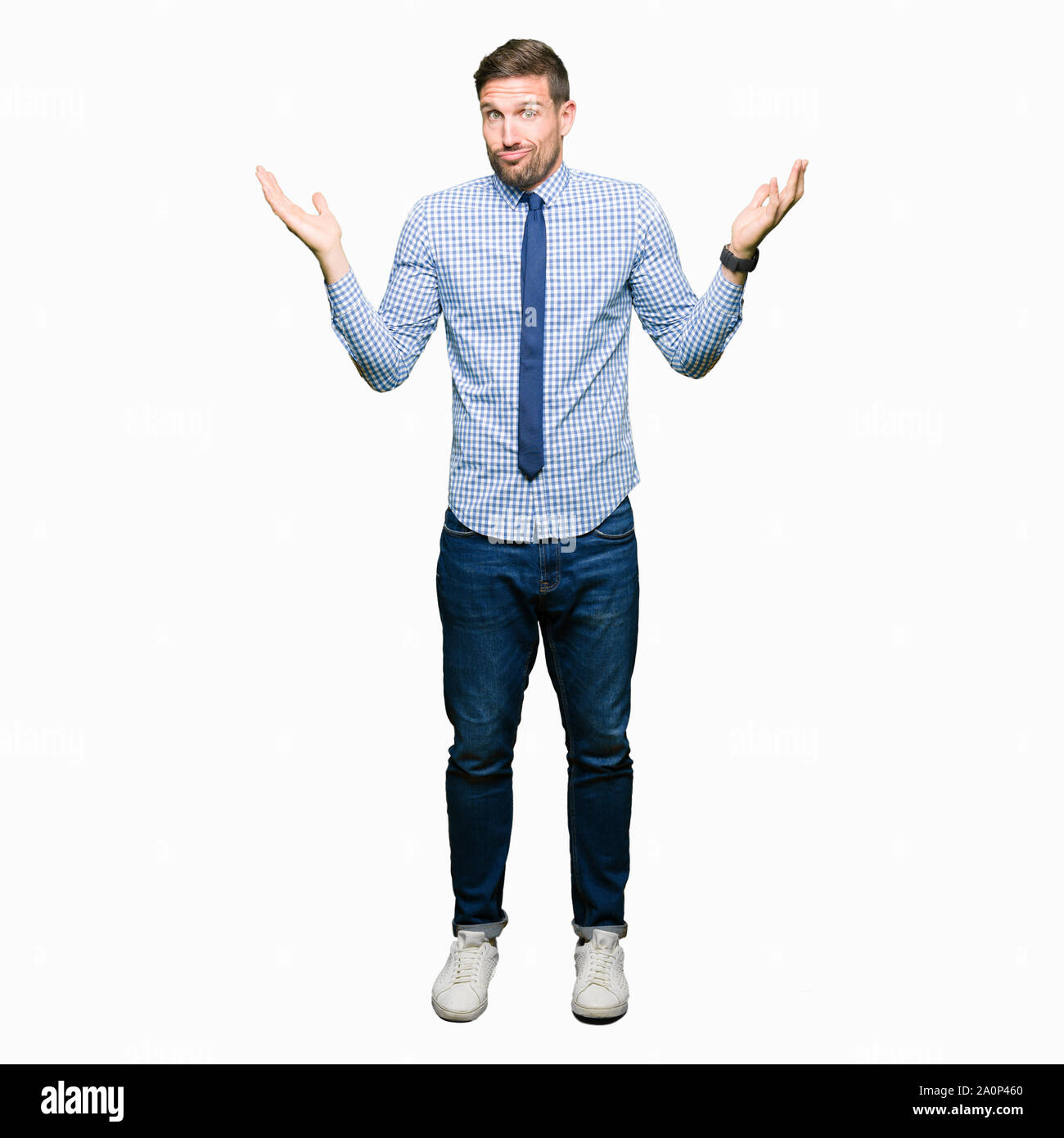 Handsome business man wearing tie clueless and confused expression with ...