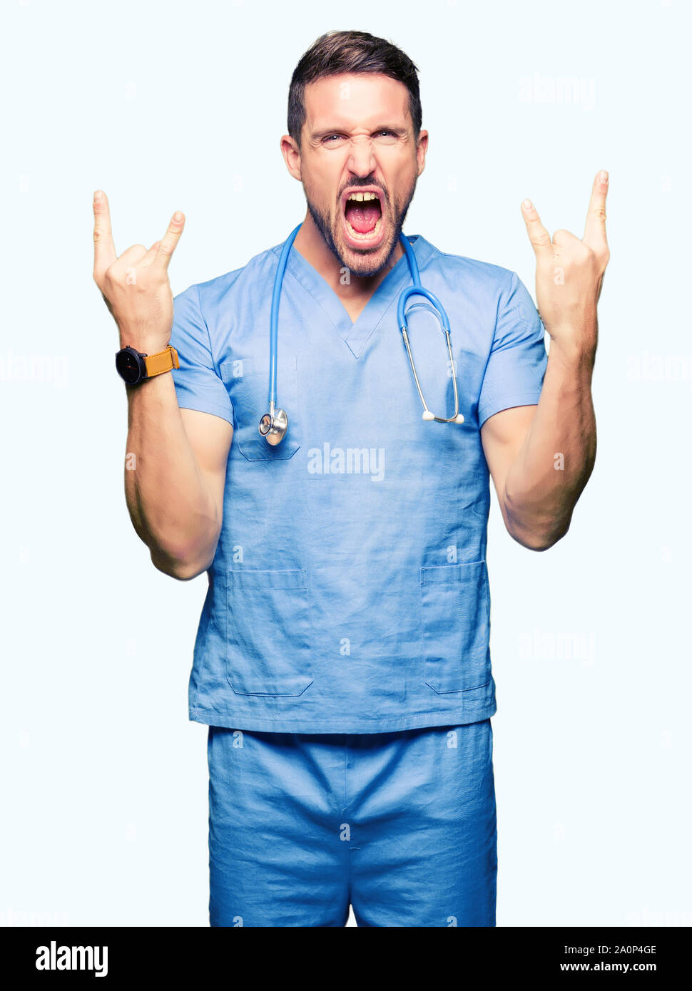 Handsome doctor man wearing medical uniform over isolated background ...