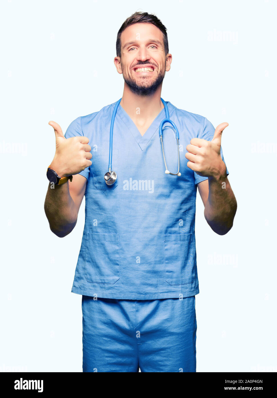 Handsome doctor man wearing medical uniform over isolated background ...