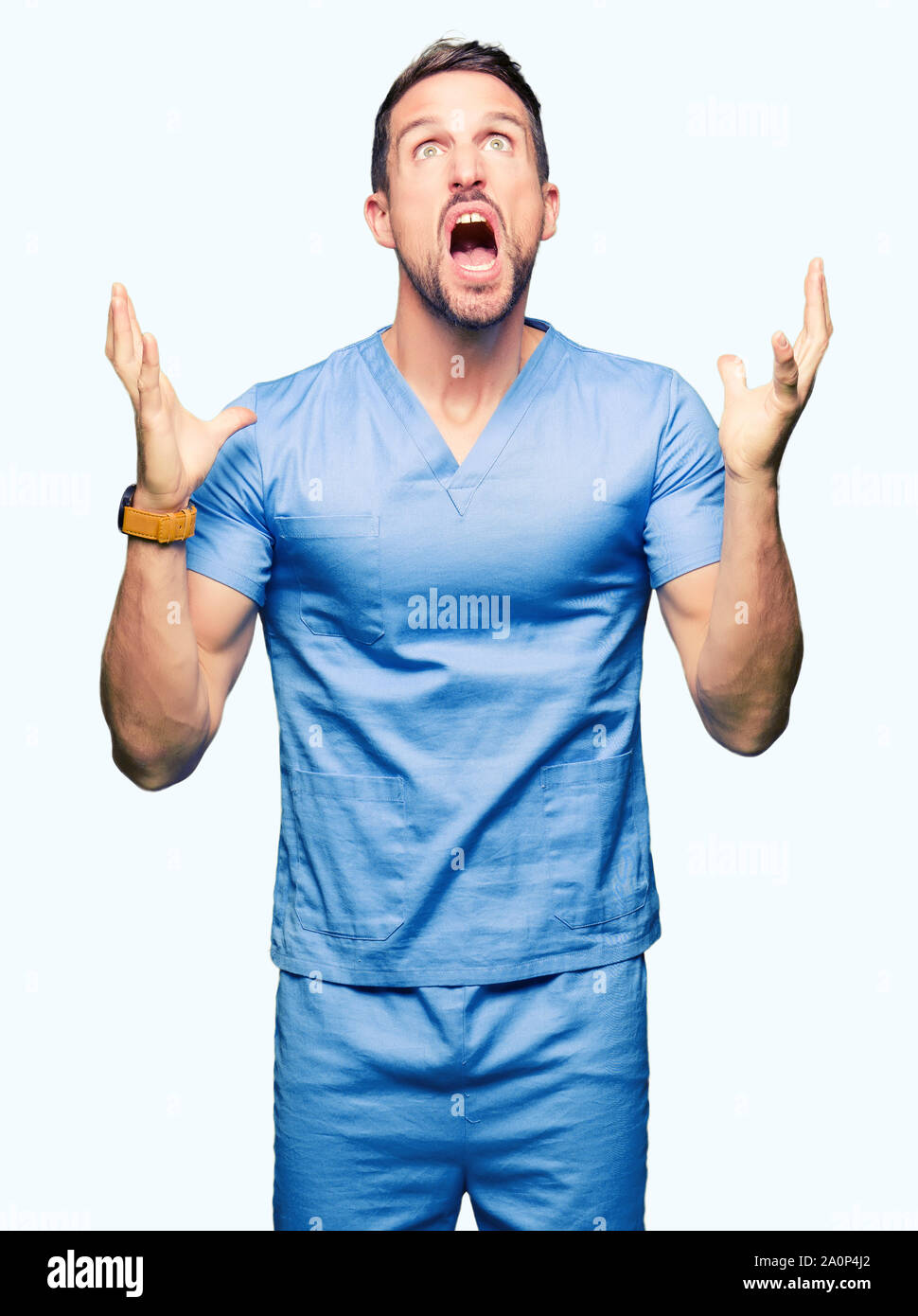 Handsome doctor man wearing medical uniform over isolated background ...