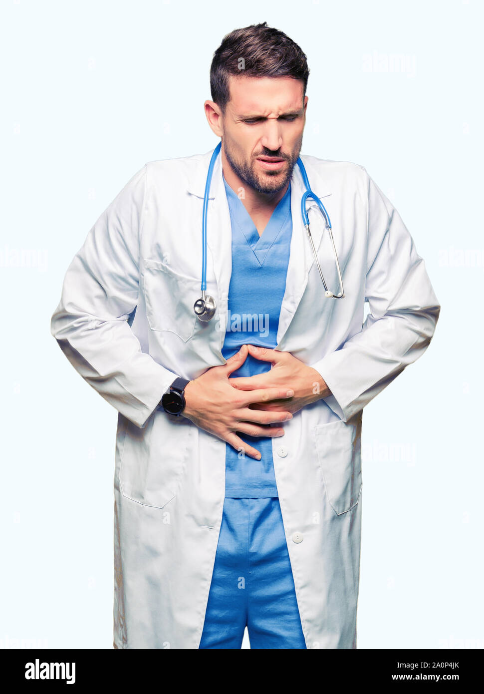 Handsome doctor man wearing medical uniform over isolated background ...