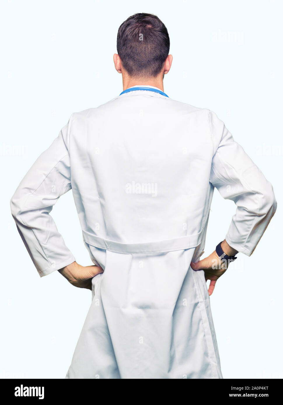 Handsome doctor man wearing medical uniform over isolated background ...