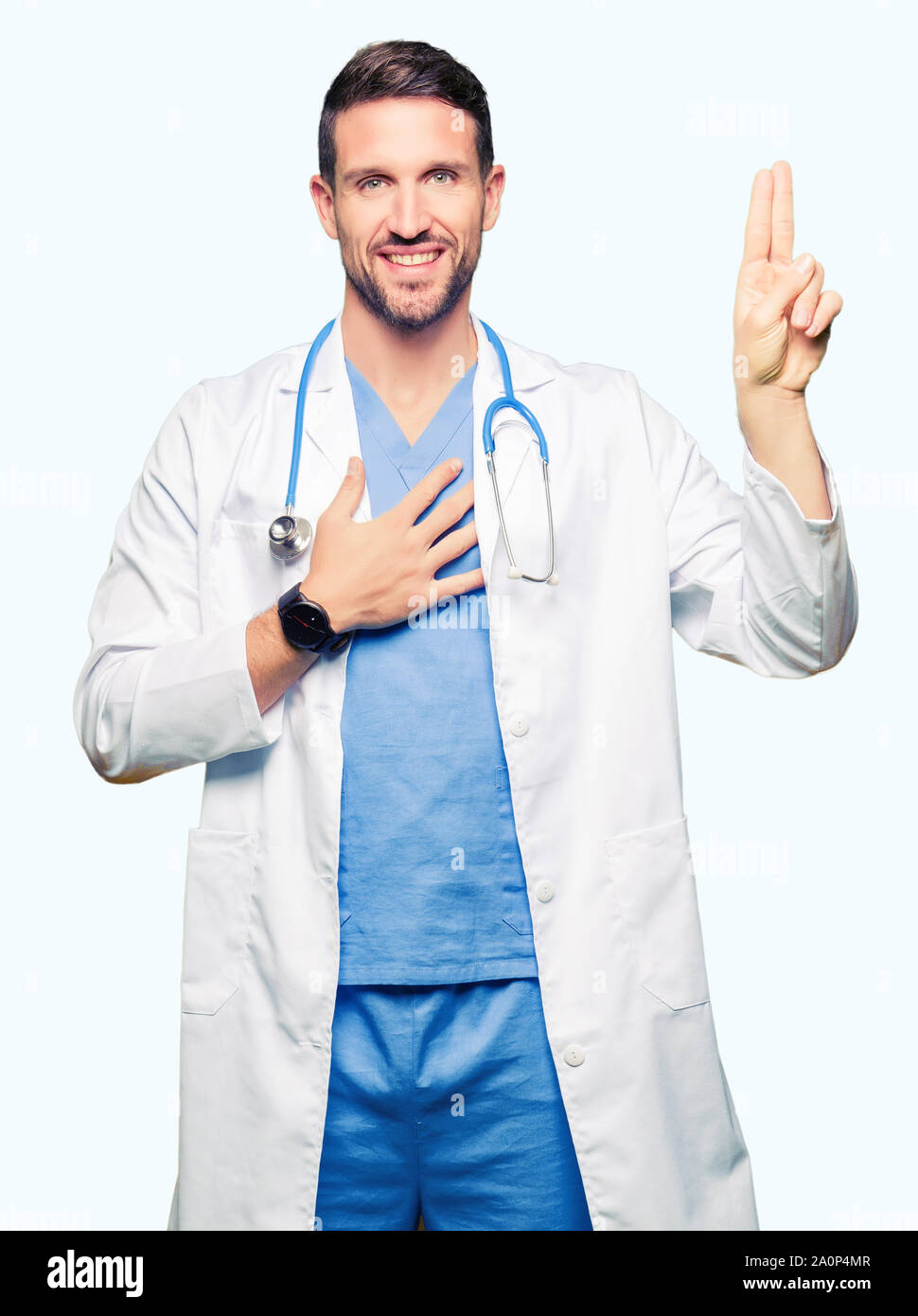 Handsome doctor man wearing medical uniform over isolated background ...