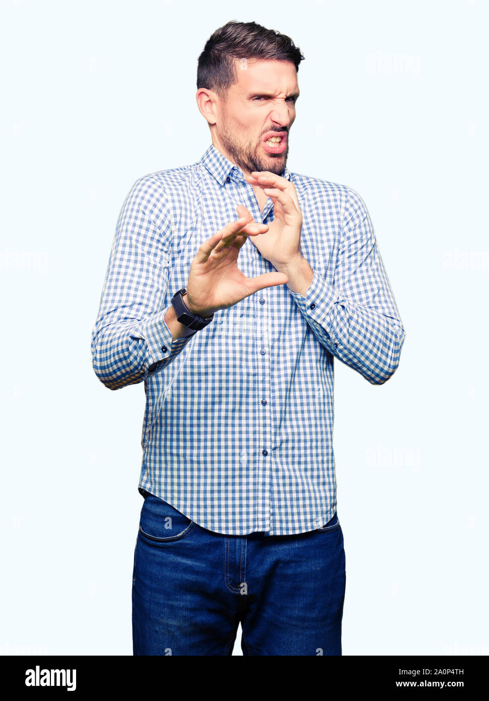 Handsome business man with blue eyes disgusted expression, displeased ...