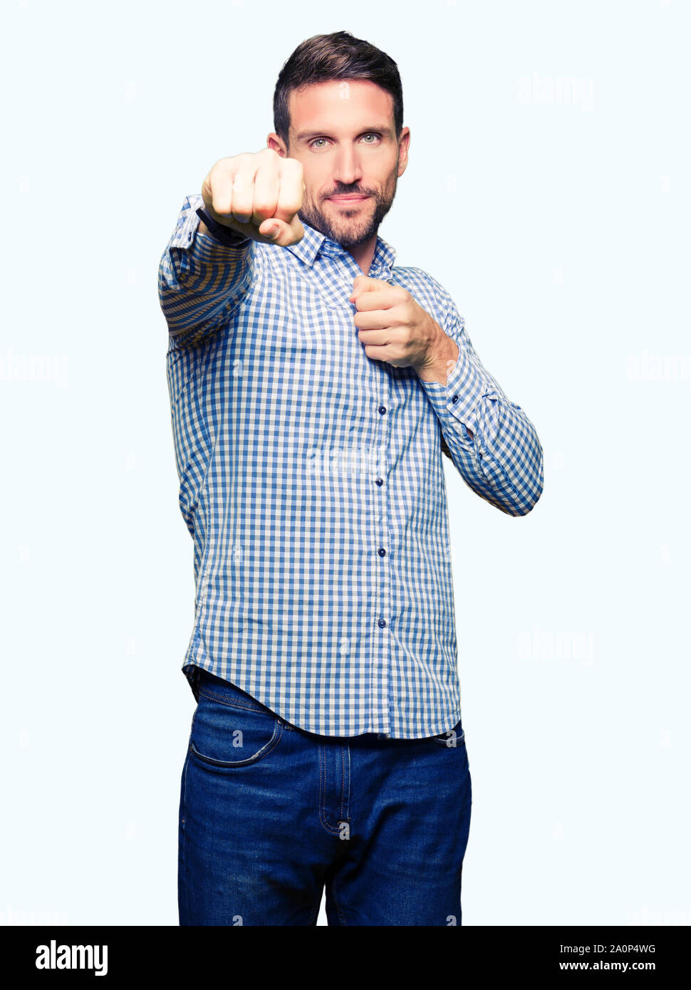 Handsome business man with blue eyes Punching fist to fight, aggressive ...