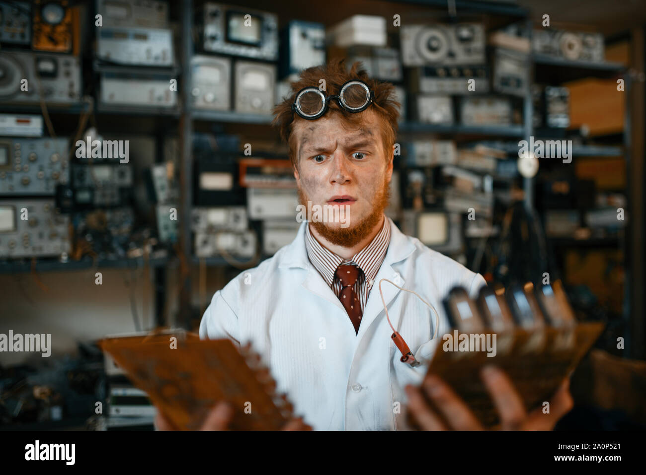 Strange engineer looks on electronic chips in lab Stock Photo - Alamy