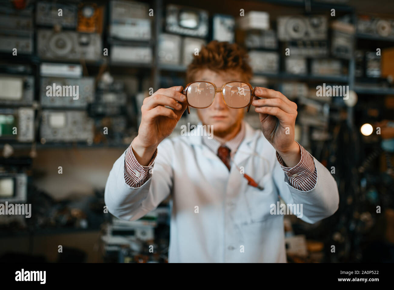 Strange scientist looks through the glasses in lab Stock Photo - Alamy