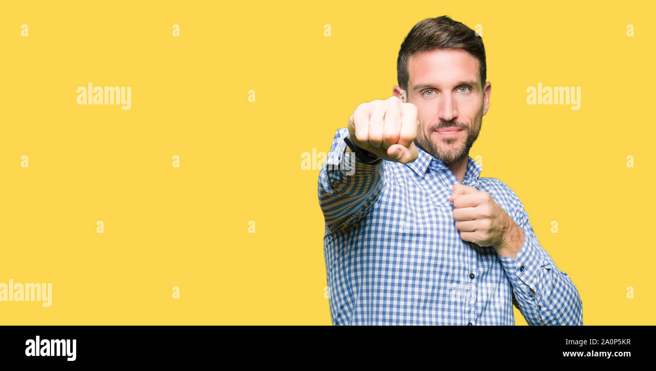 Handsome business man with blue eyes Punching fist to fight, aggressive ...