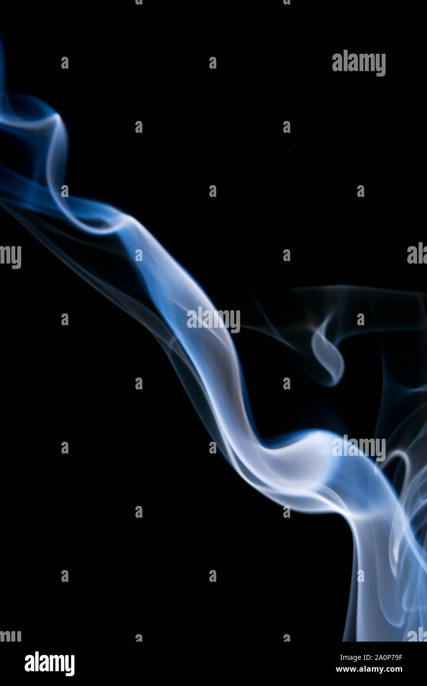 Delicate streak of smoke on black background, delightful aroma Stock ...