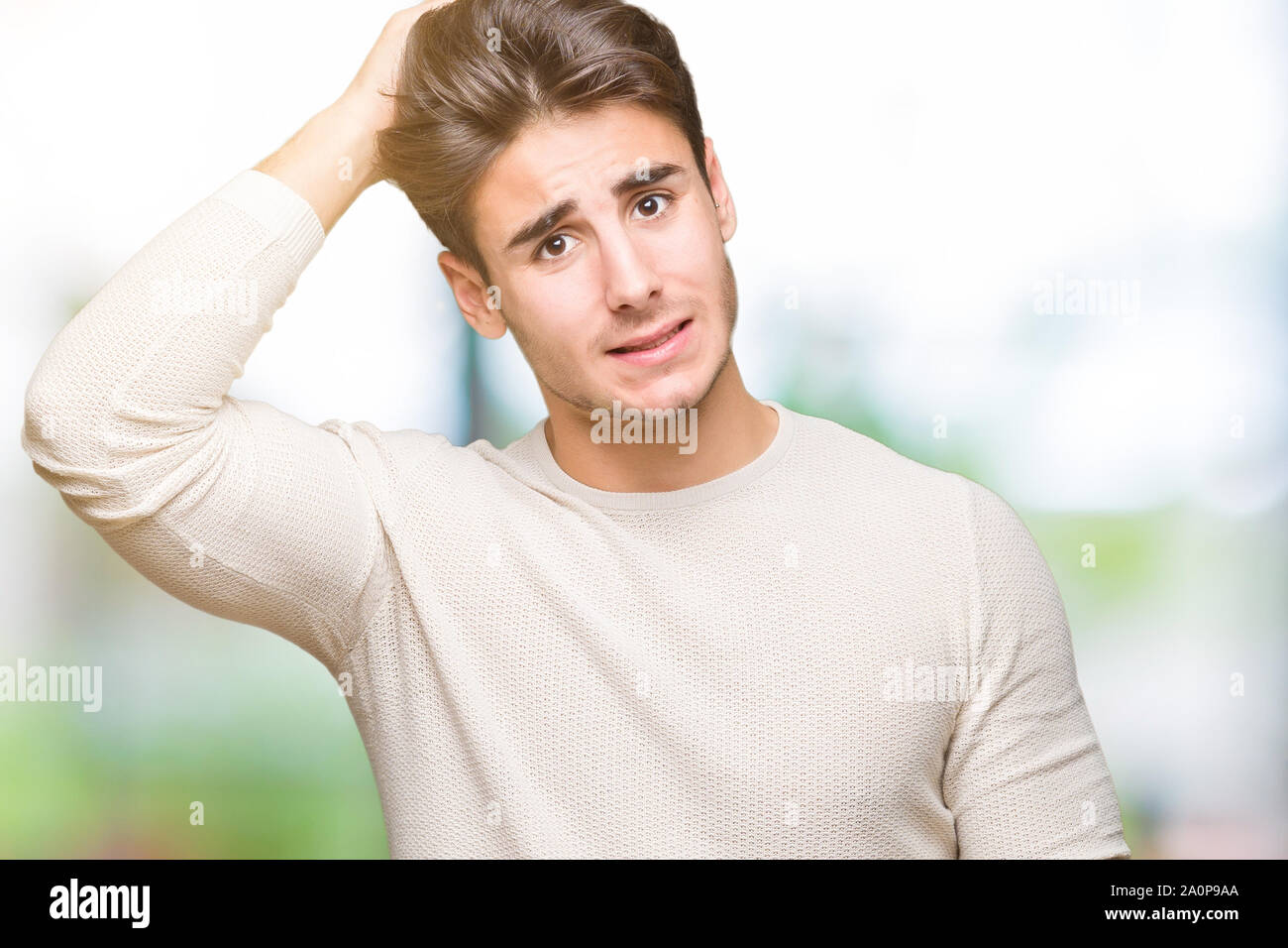 Young handsome man over isolated background confuse and wonder about ...
