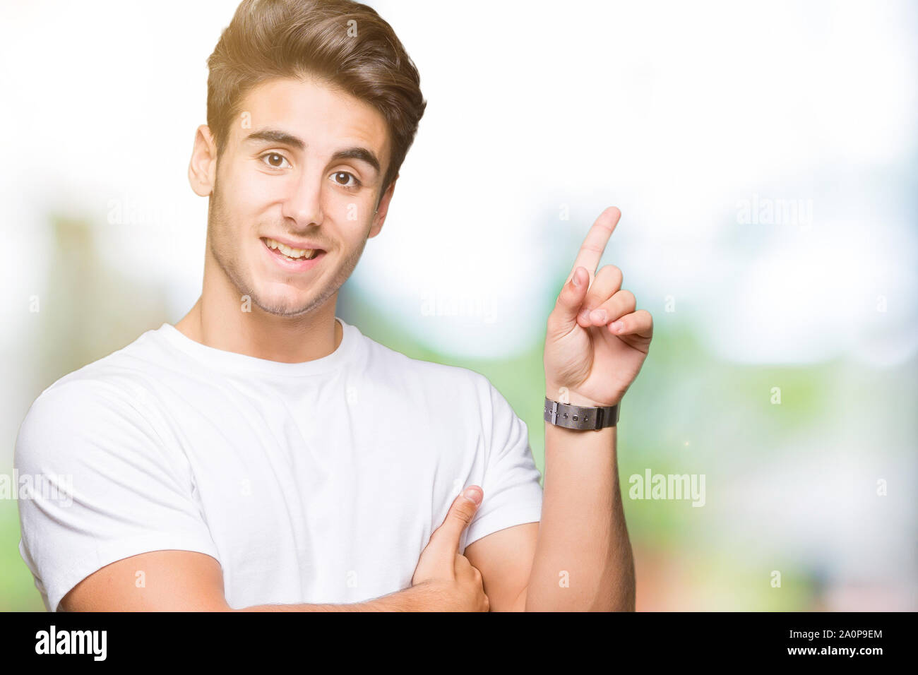 Young handsome man wearing white t-shirt over isolated background with ...