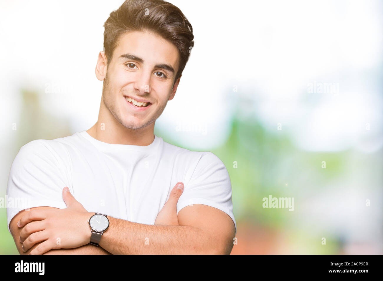 Young handsome man wearing white t-shirt over isolated background happy ...