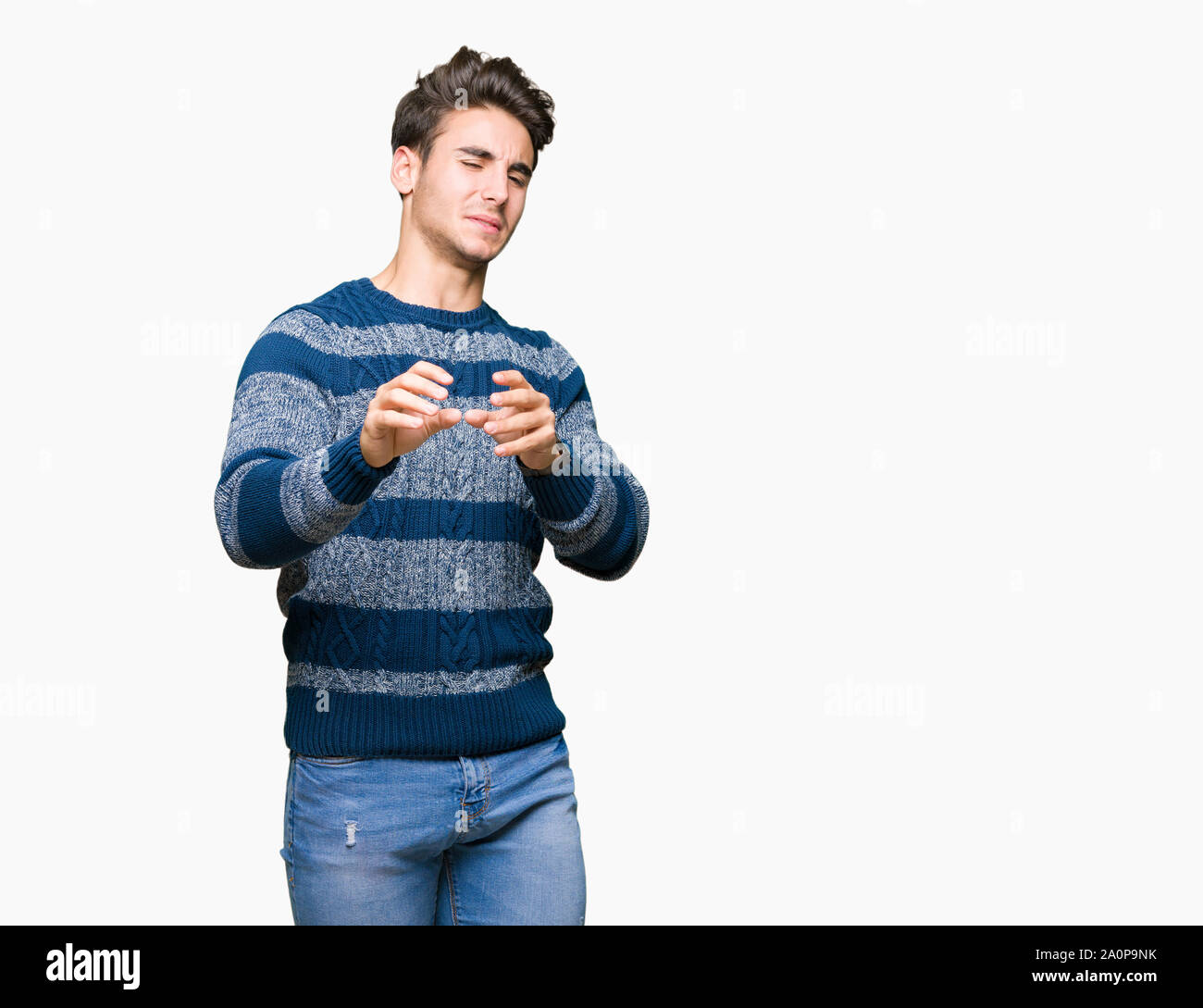Young handsome man over isolated background disgusted expression ...