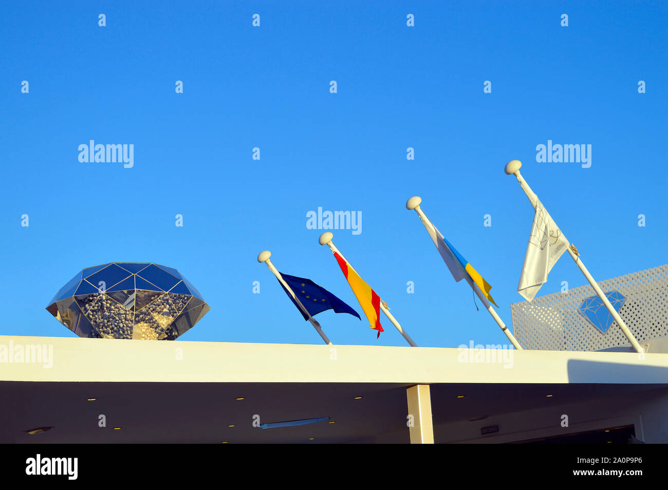 Diamond and flags on the roof of a building Stock Photo - Alamy