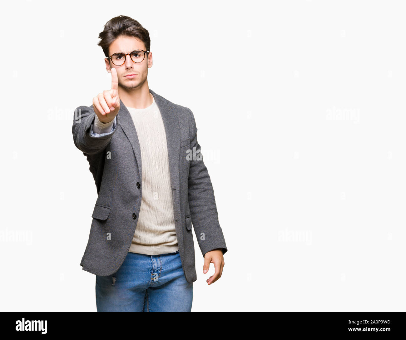 Young business man wearing glasses over isolated background Pointing ...