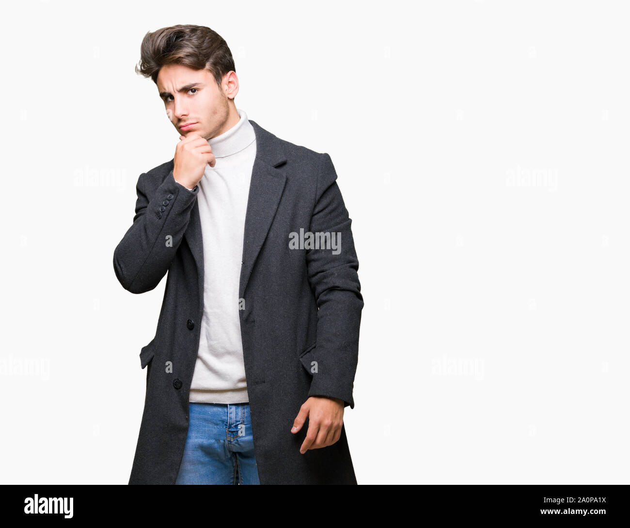 Young elegant man wearing winter coat over isolated background with ...