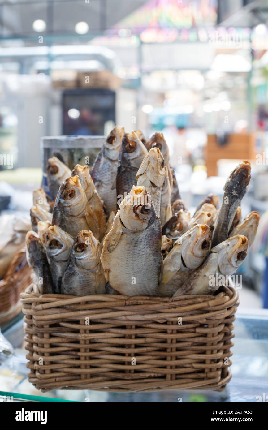 Dried salted perch fish in basket close up, dry sea bass sale on ...