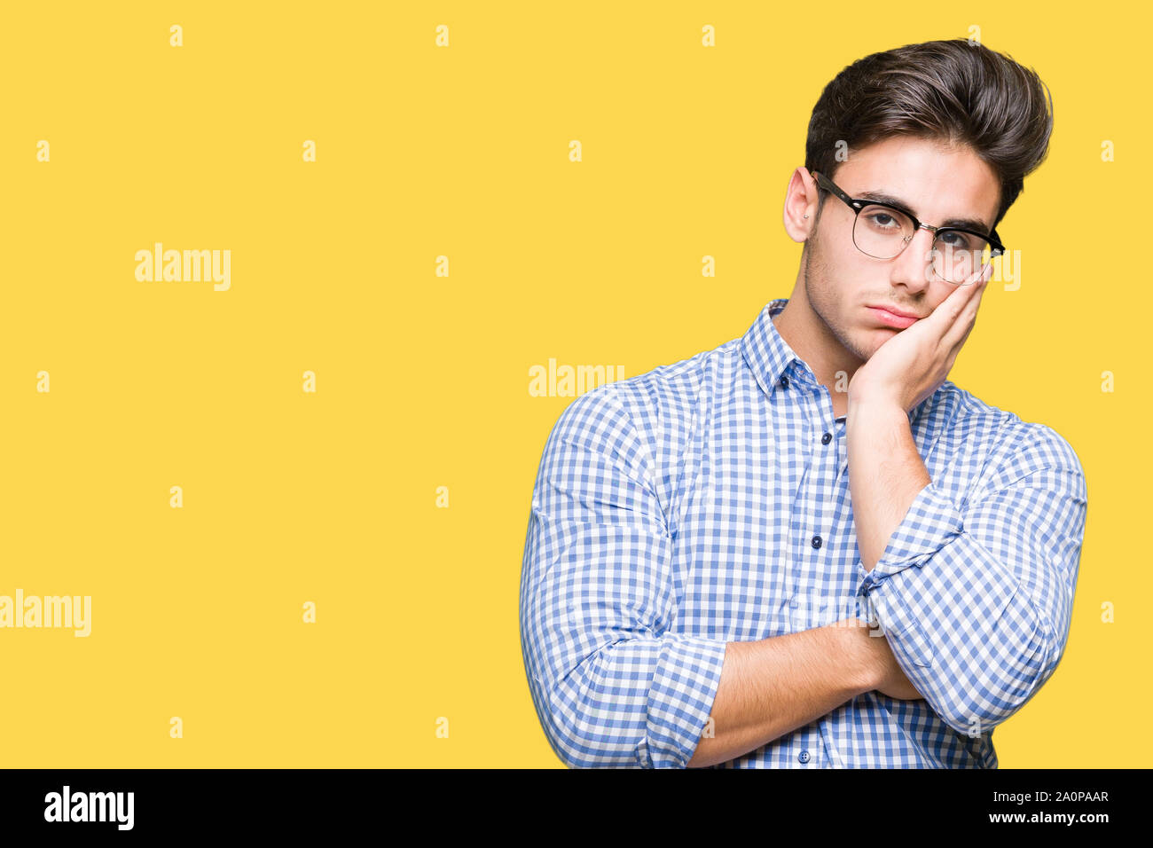 Young handsome man wearing glasses over isolated background thinking ...